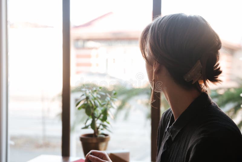 Back View of Woman Sitting at the Table in Cafe Stock Photo - Image of ...