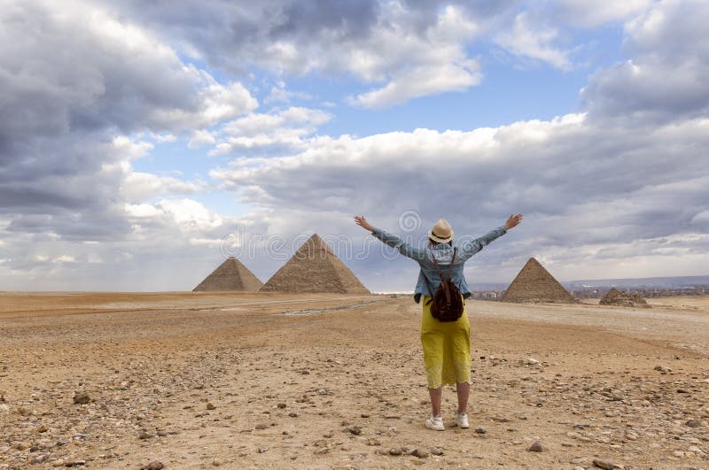 Back View of a Woman Wearing a Hat, Looking at the 3 Great Pyramids in ...