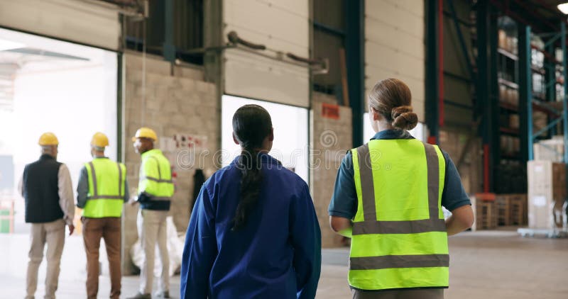 Back View, Women and Meeting in Warehouse for Construction ...