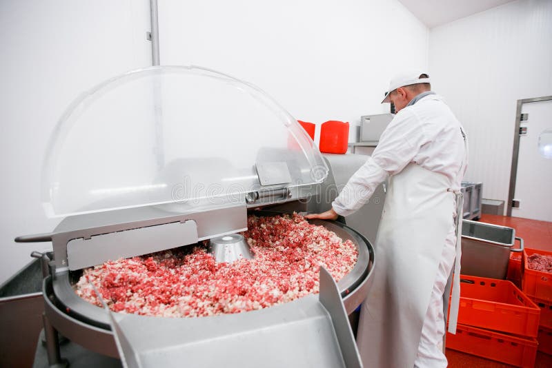 A Worker in the Meat Factory, he Arranges Pieces of Meat Marinated in ...