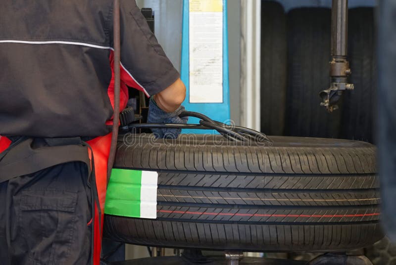 Service Workers Change Tires Stock Photos - Free & Royalty-Free Stock ...