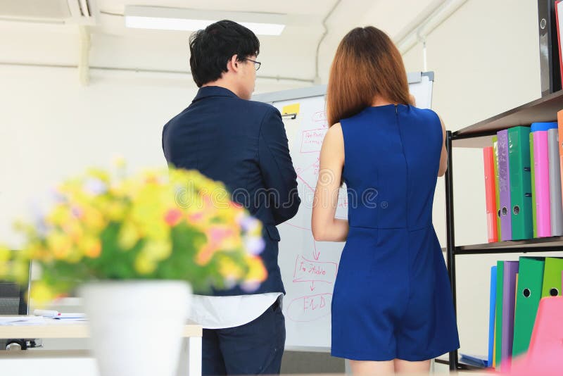 Back View of Young Asian Business People Working Together in Office ...