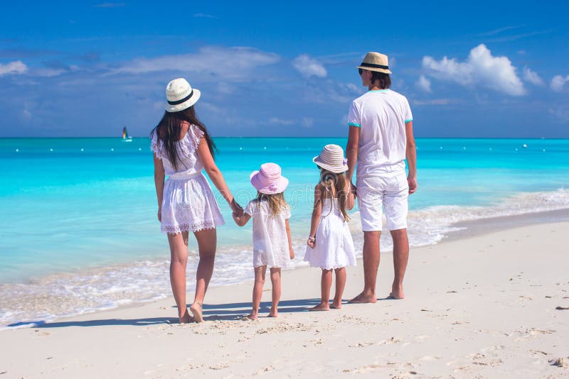 Back View of a Young Beautiful Family on Tropical Beach Stock Image ...