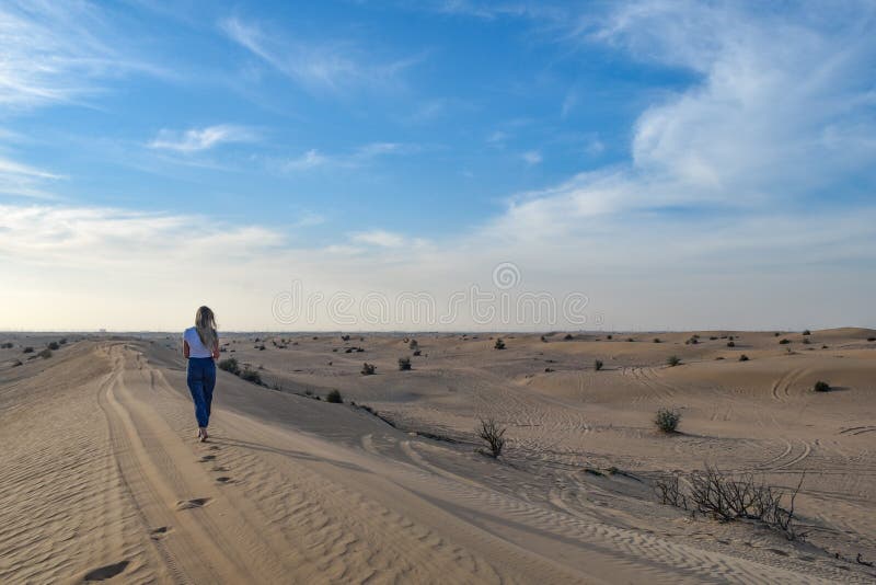 Back View of a Young Blonde Female Having Fun in the Desert Stock Image ...