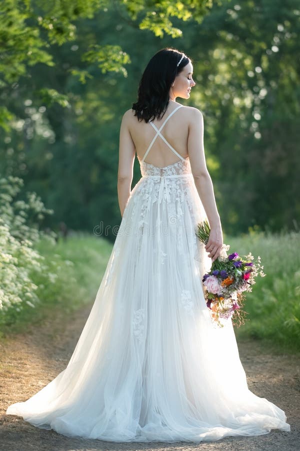 Back view of a young bride stock photo. Image of flowers - 291364174