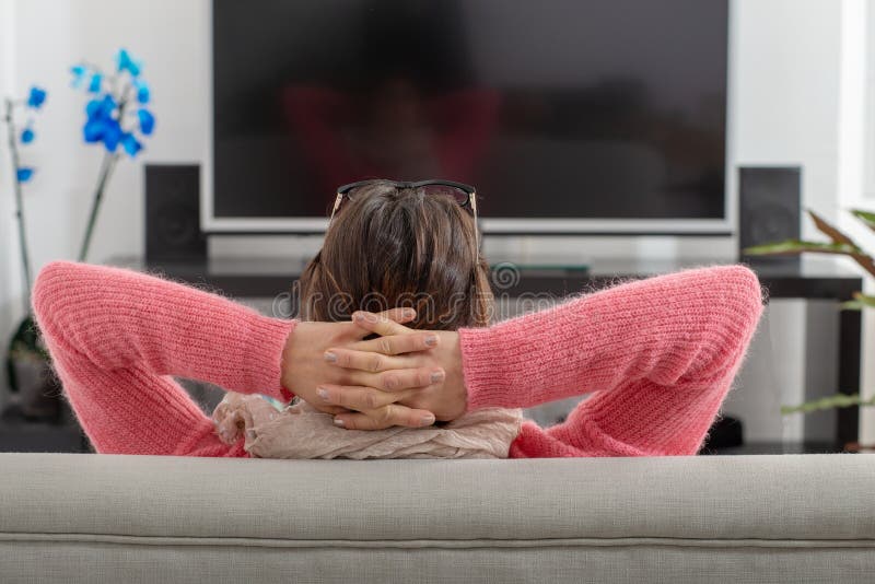 Back View of a Young Brunette Woman Watching TV Stock Photo - Image of ...