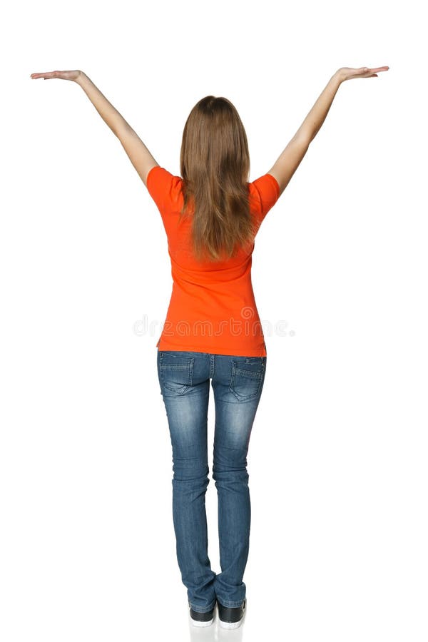 Back View of Young Casual Female in Full Length Pointing at Blank Copy ...