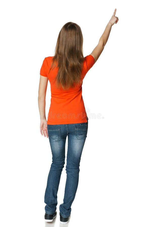 Back View of Young Casual Female in Full Length Pointing at Blank Copy ...