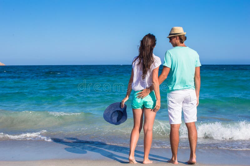 Back View of Young Family Looking To the Sea in Stock Image - Image of ...