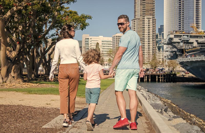 Back View of Young Family Walking in Park with Child, Family Day Stock ...