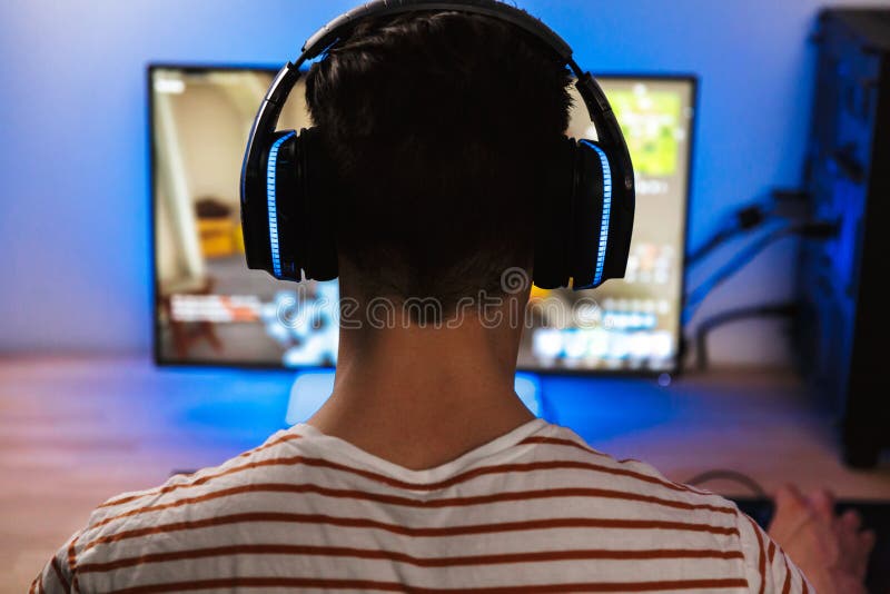 Back View of Young Gamer Playing Video Games on Computer Stock Photo ...