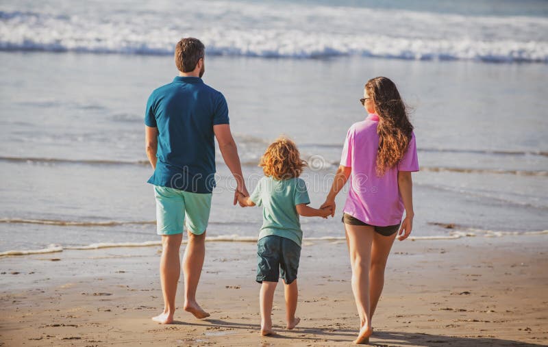 Back View of Young Happy Family on the Beach Vacation. Stock Photo ...
