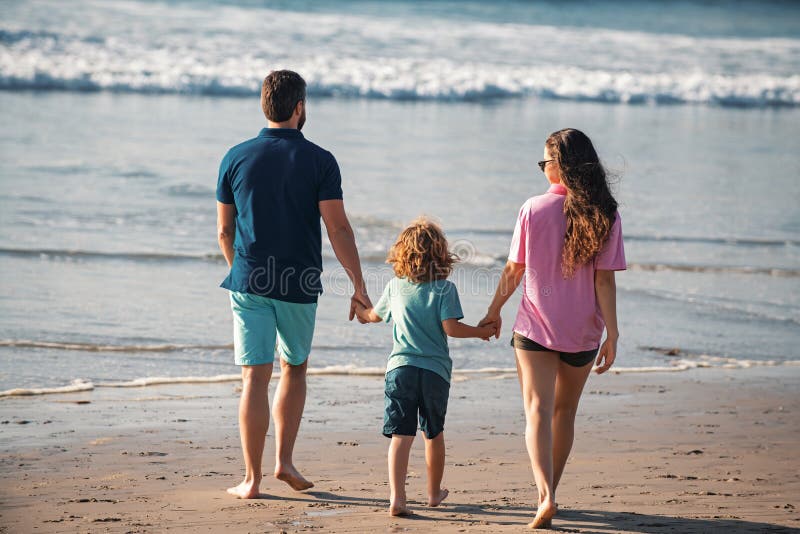 Back View of Young Happy Family on the Beach Vacation. Stock Image ...