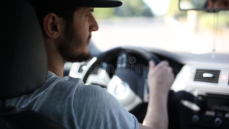 Back View of Young Man Driving the Car. Stock Footage - Video of ...
