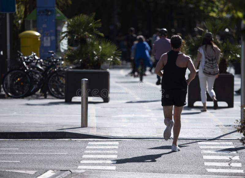 Back View of a Young Man Jogging Outdoors Stock Image - Image of young ...