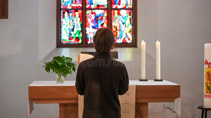 Back View of a Young Man Praying at the Altar in a Church Stock Image ...