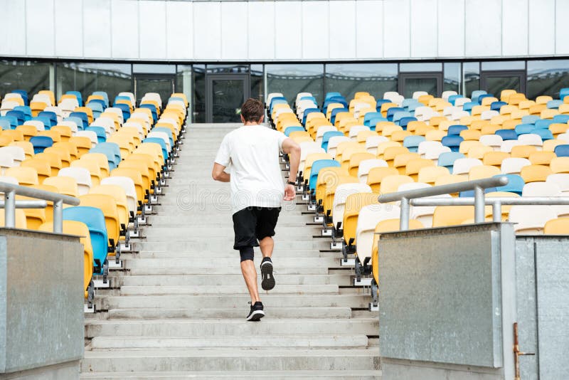 Back View of a Young Man Running Upstairs Stock Image - Image of ...