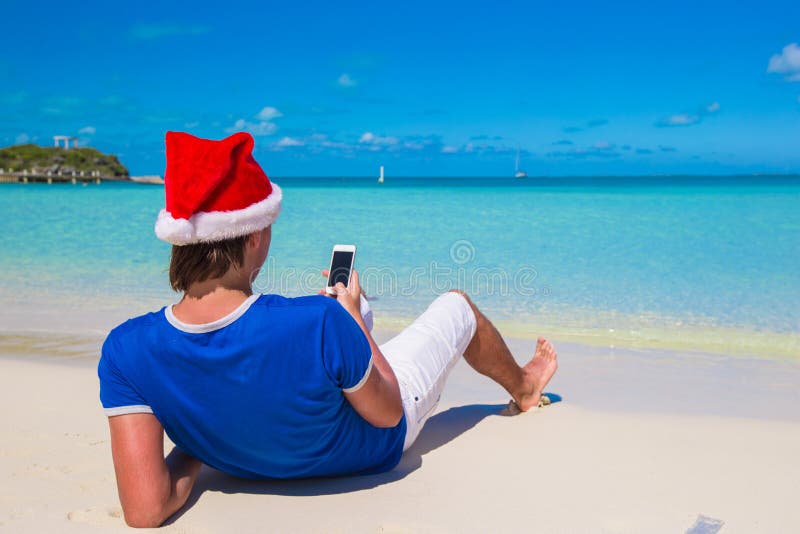 Back View of Young Man in Santa Hat with Phone on Stock Image - Image ...