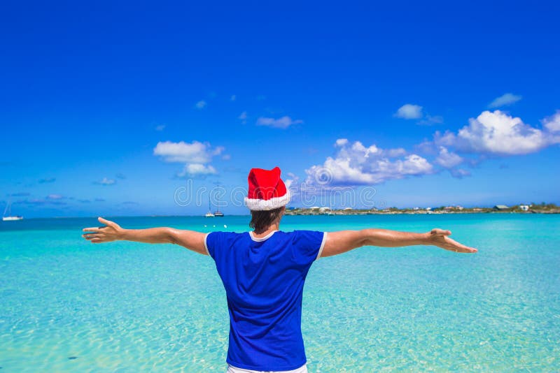 Back View of Young Man in Santa Hat on Tropical Stock Photo - Image of ...