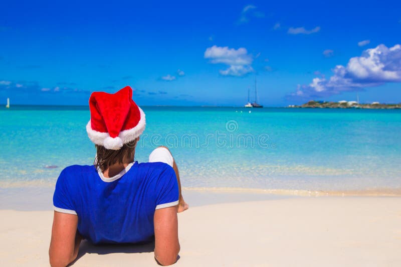 Back View of Young Man in Santa Hat on Tropical Stock Image - Image of ...