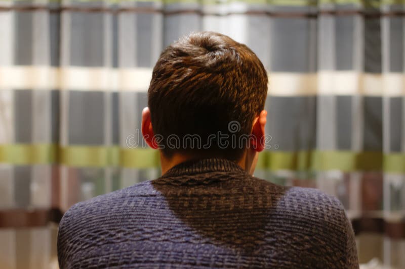 Back View of Young Man Sitting Home and Thinking. Lost in Thoughts ...