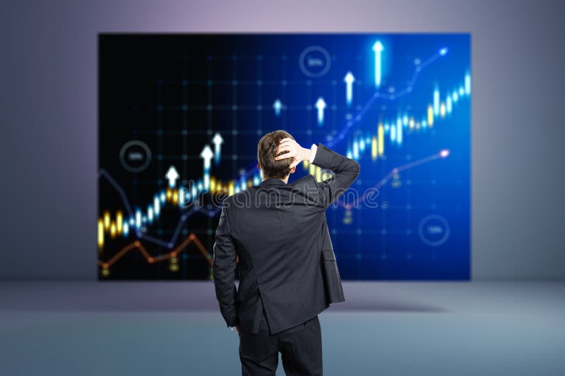 Back View of Man Standing in Interior with Blue Forex Chart on Screen ...