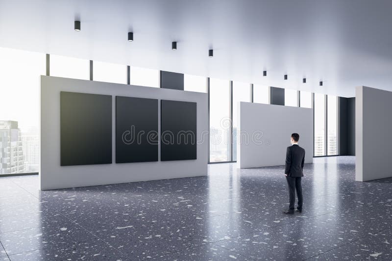 Back View of Man Thinking in Modern Bright Gallery Interior with Mock ...