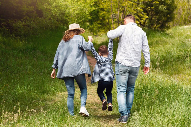 Back View of Young Parents on Walk with Their Child at Countryside ...