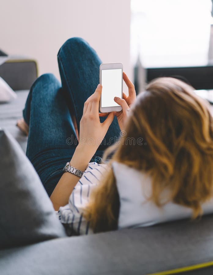 Back View of Young Woman Lying on Comfortable Sofa in Own Room with ...