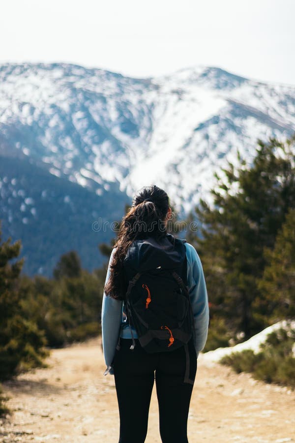 Back View of a Young Woman in a Snowy Mountain Stock Photo - Image of ...