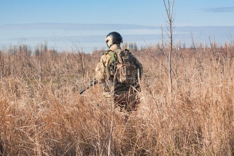 Back of Walking Soldier in Fields Stock Photo - Image of soldier ...