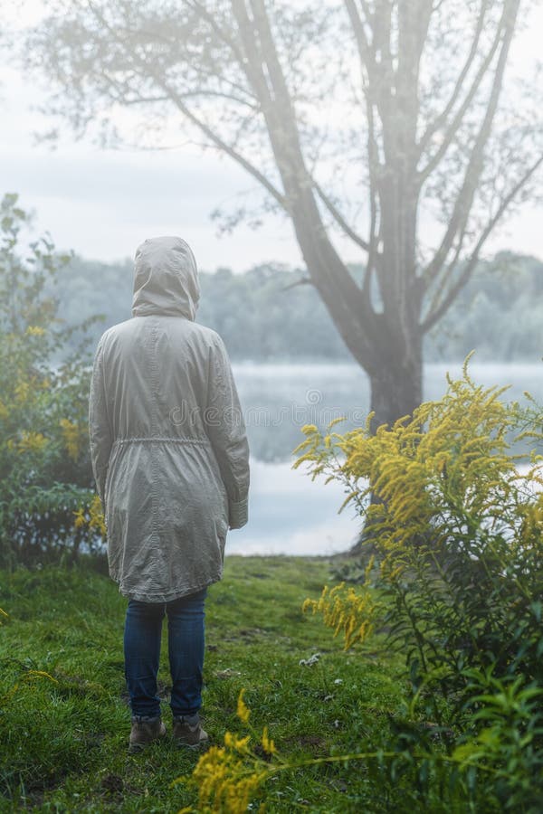 Back of a Woman with Depression Standing Alone at the Lake Stock Image ...