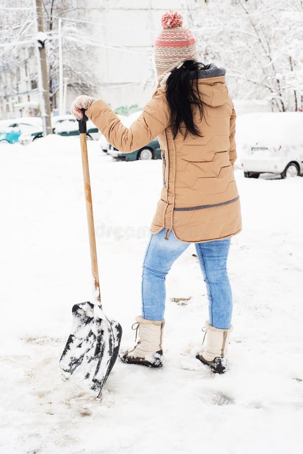 Back of Woman Take a Break from Shoveling Stock Photo - Image of ...