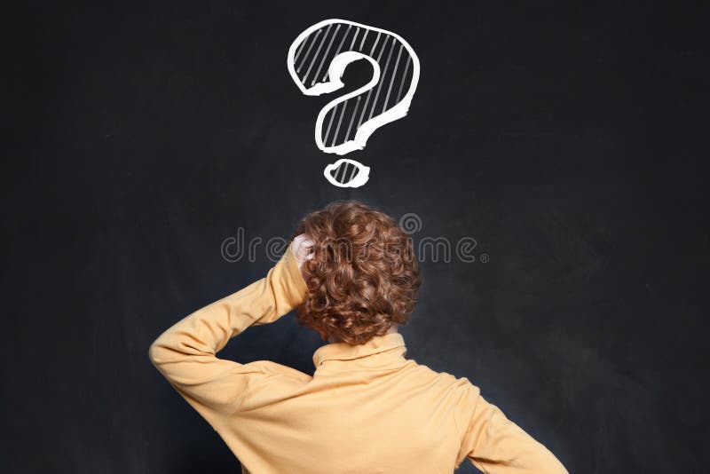 Back of Young Boy School Student Looking at Question Mark on Blackboard ...