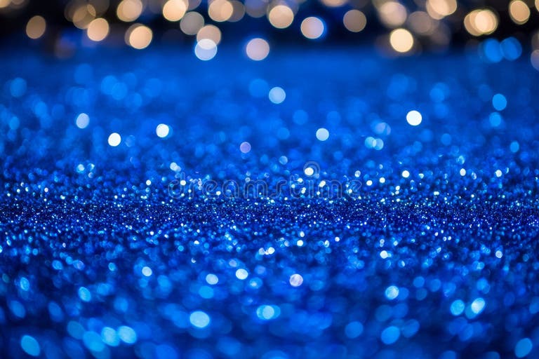 A Backdrop of Blurred Glittering Lights in Silver, Blue, and Gold ...