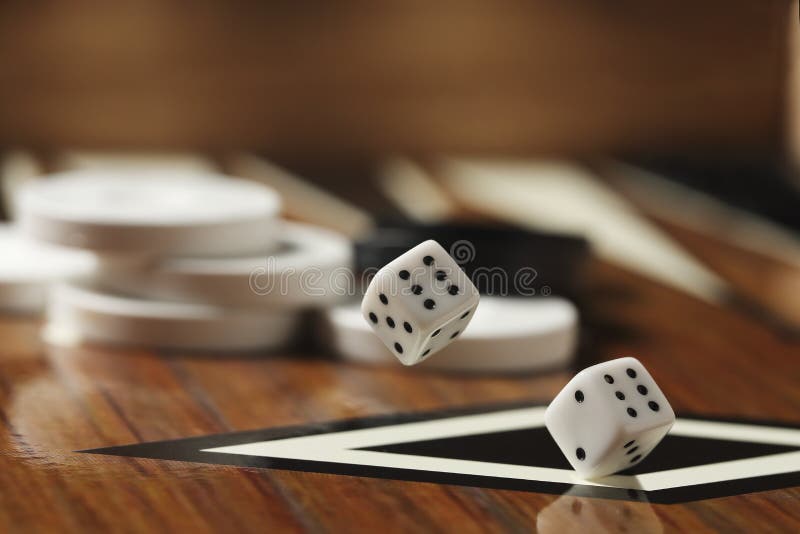 Backgammon dice rolling stock photo. Image of table - 246488472