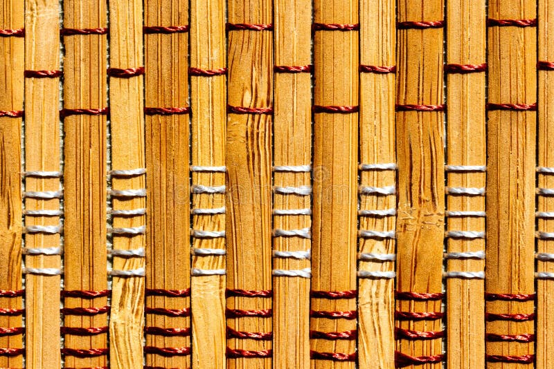 A Background of Bamboo Stems Intertwined with Threads Stock Photo ...