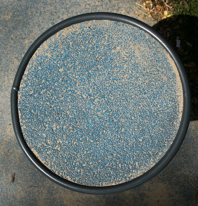Background. in a Black Circle, Small Drops of Blue Paint on a Sandy ...