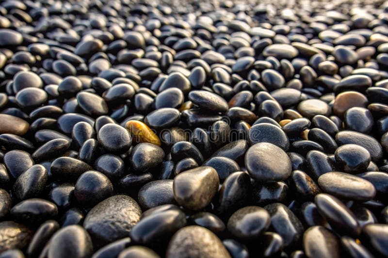 Natural Serenity: Background of Black Pebbles and Smooth Rocks from a ...