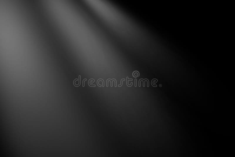 The Background is Black and a Spotlight Shines Down from the Side ...