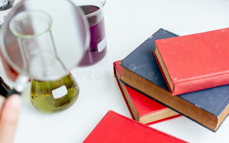Background of Books, Test Experimental Tube and Magnifying Glasses on ...
