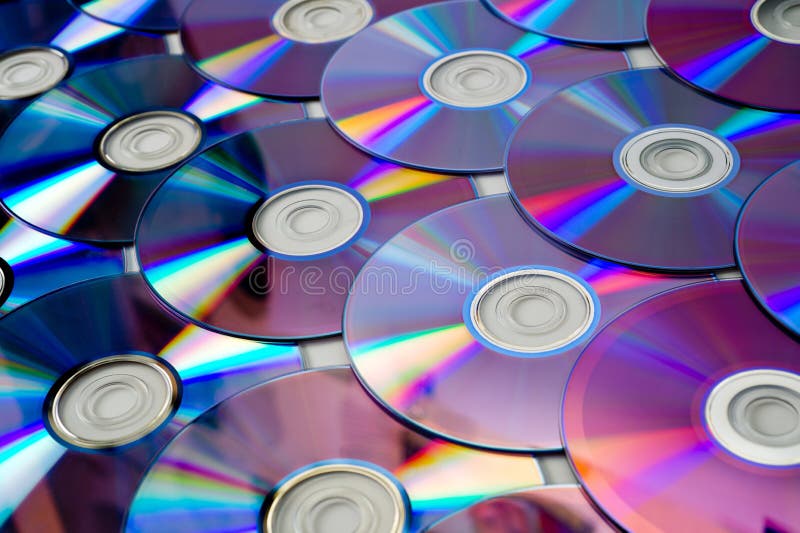 Background of CD and DVD Discs Laid Out on a Flat Surface Stock Photo ...