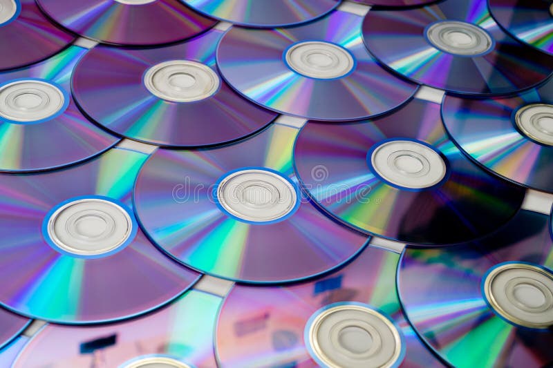 Background of CD and DVD Discs Laid Out on a Flat Surface Stock Photo ...