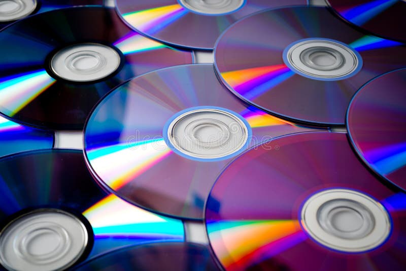 Background CD and DVD Discs Laid Out on a Flat Surface. Background for ...