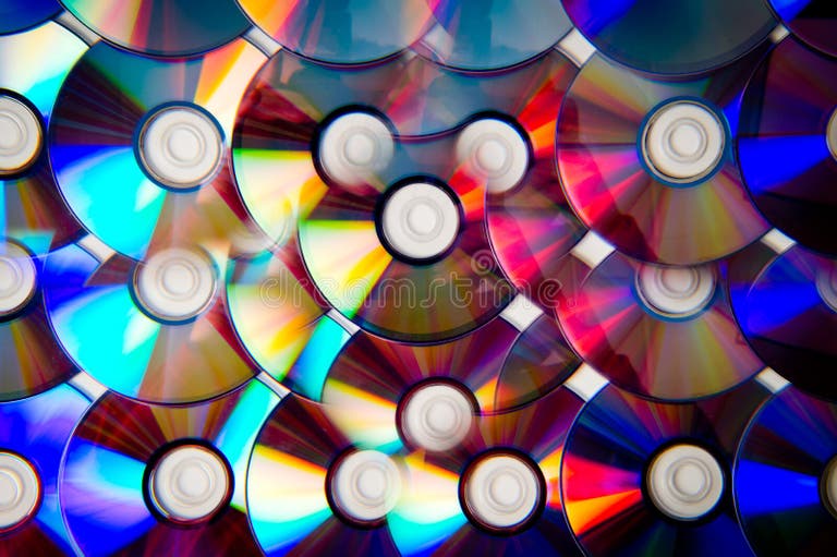 Background CD and DVD Discs Laid Out on a Flat Surface. Background for ...