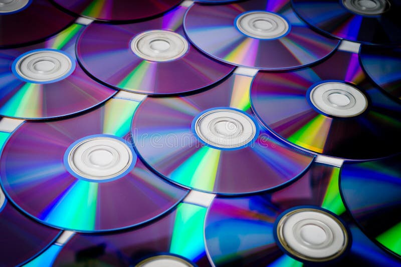 Background CD and DVD Discs Laid Out on a Flat Surface. Background for ...