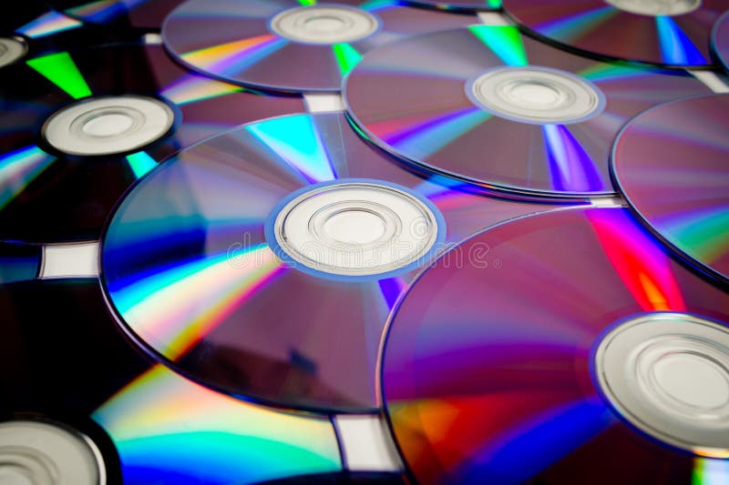 Background CD and DVD Discs Laid Out on a Flat Surface. Background for ...