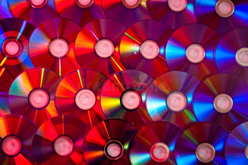 Background CD and DVD Discs Laid Out on a Flat Surface. Background for ...