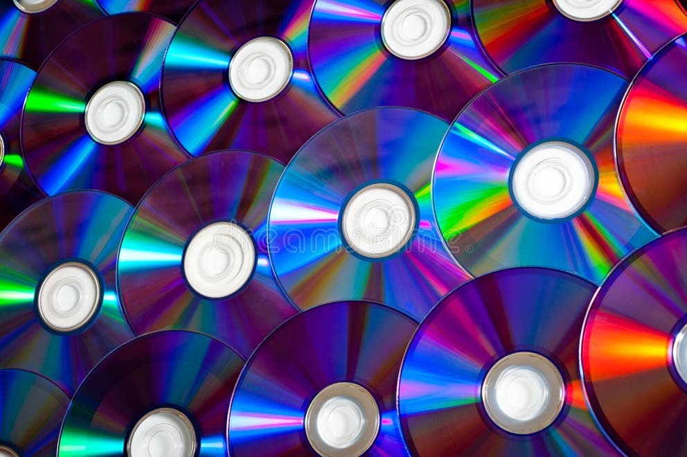 Background CD and DVD Discs Laid Out on a Flat Surface. Background for ...