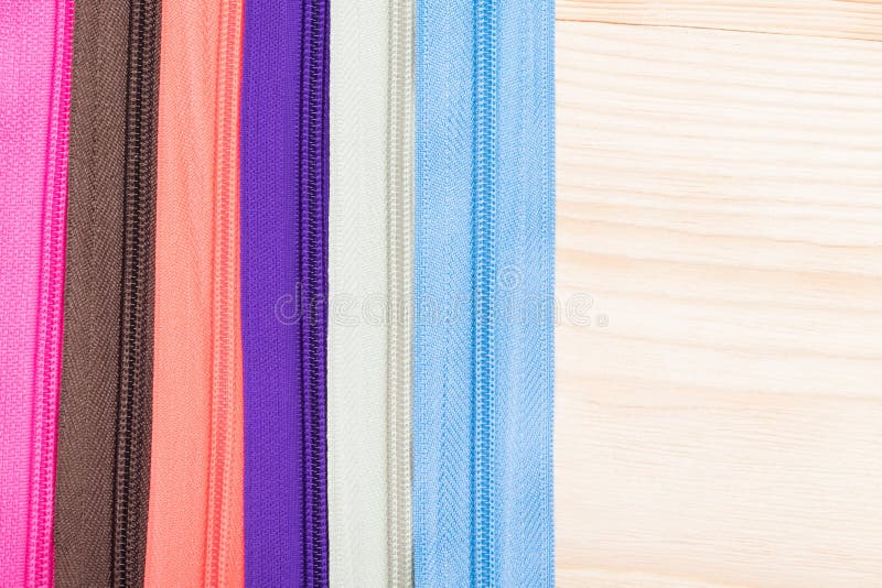 Background of Colored Bright Zippers for Clothes and Fabrics Stock ...